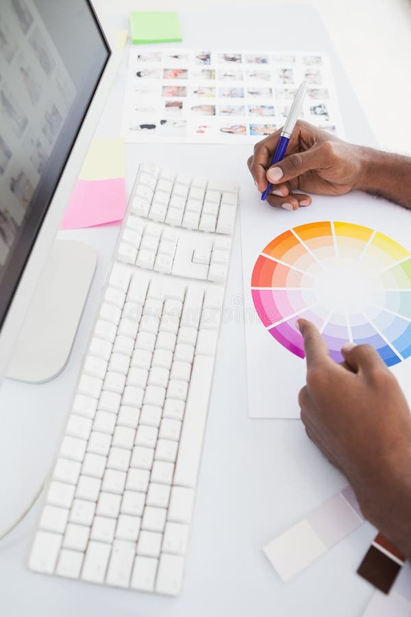 Businessman Working with Colour Wheel and Taking Notes Stock Photo ...