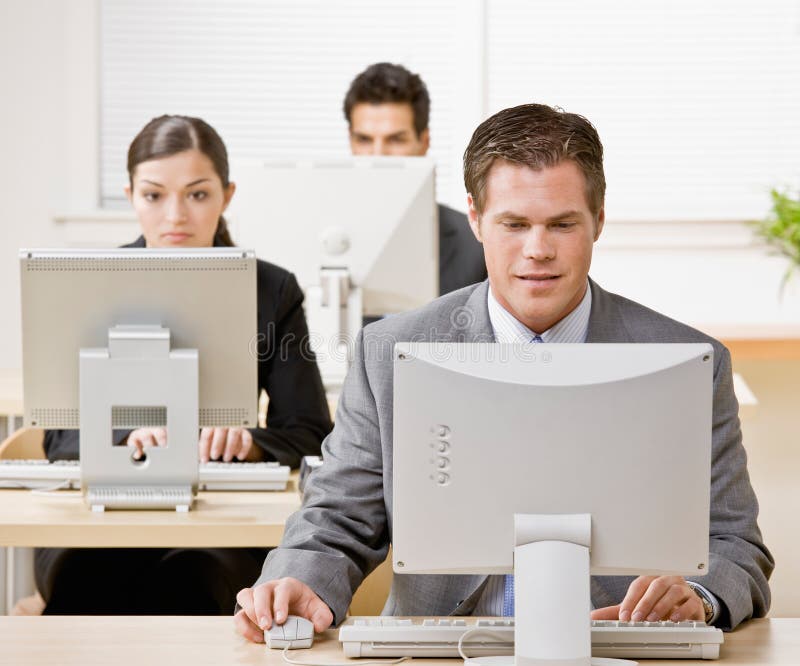 Co-workers Working at Computers in Call Center Stock Image - Image of ...