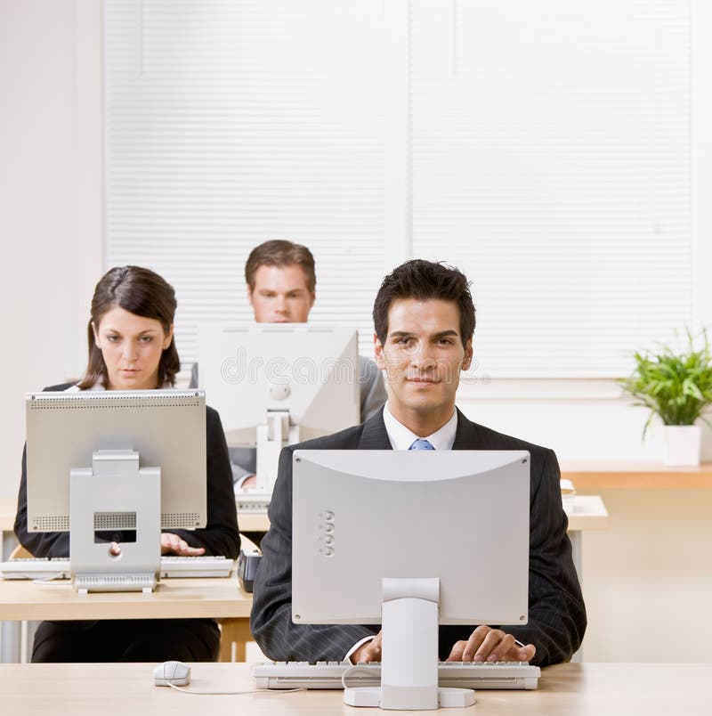Co-workers Working at Computers in Call Center Stock Image - Image of ...