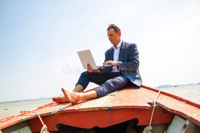 Young Man Working on His Laptop on Beach Stock Image - Image of ...