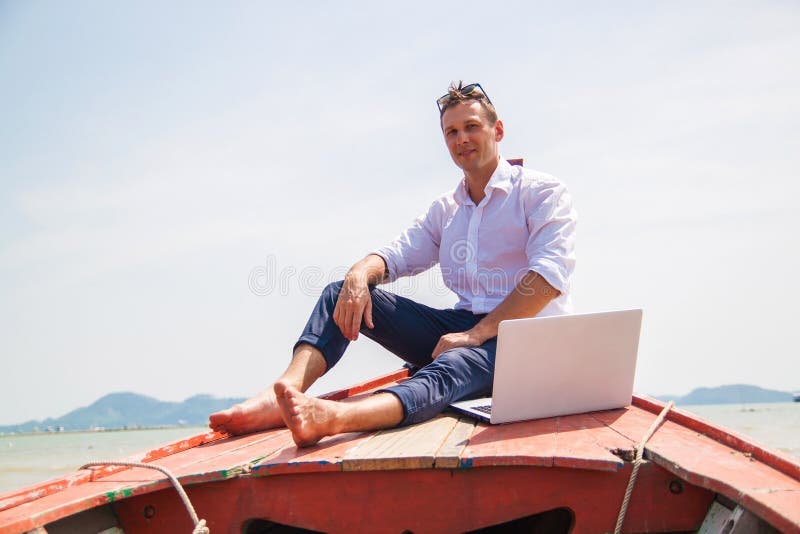 Businessman Working with Computer on a Boat, Nice Outdoor Office. Stock ...