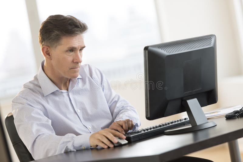 Man working in office stock photo. Image of document, professional ...