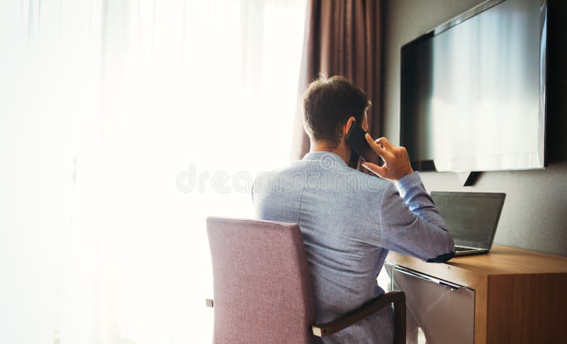 Businessman Working on Computer in Hotel Room Stock Photo - Image of ...