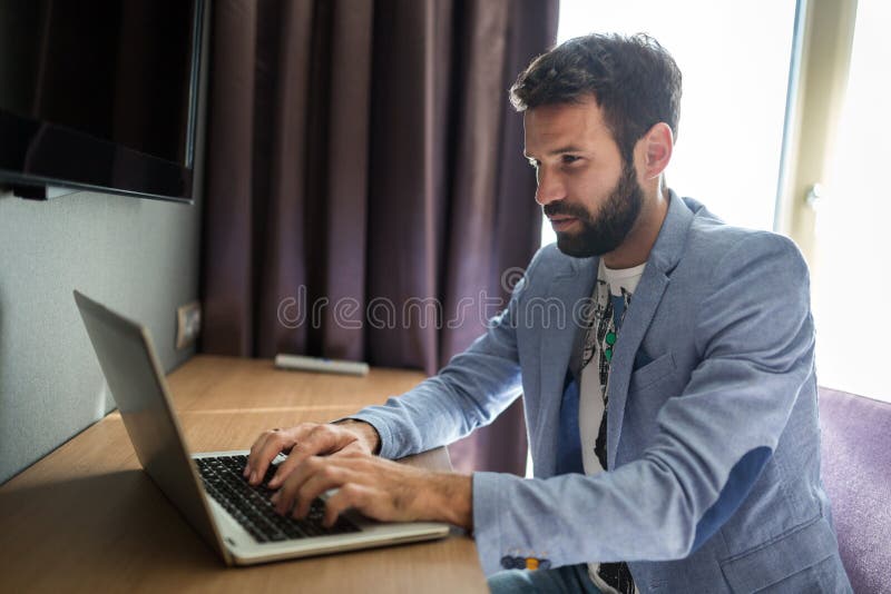 Businessman Working on Computer in Hotel Room Stock Image - Image of ...
