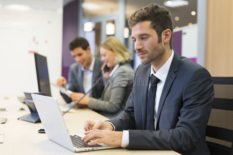 Businessman Working on Computer in Modern Office Stock Photo - Image of ...