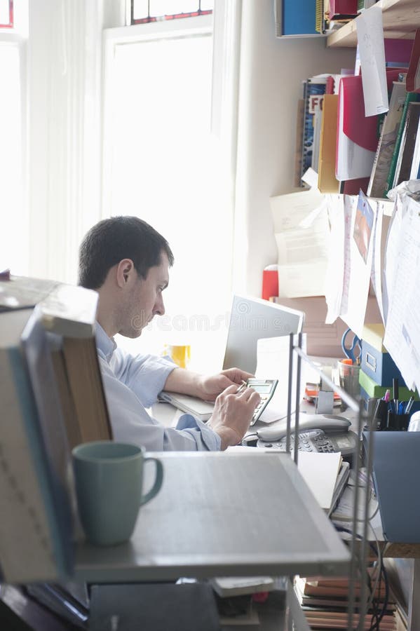 Businessman Working at Desk Stock Photo - Image of house, people: 33890172