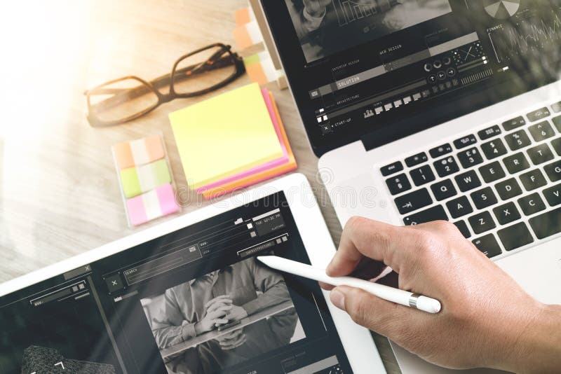 Businessman Working with Digital Tablet Computer and Memo Note a Stock ...