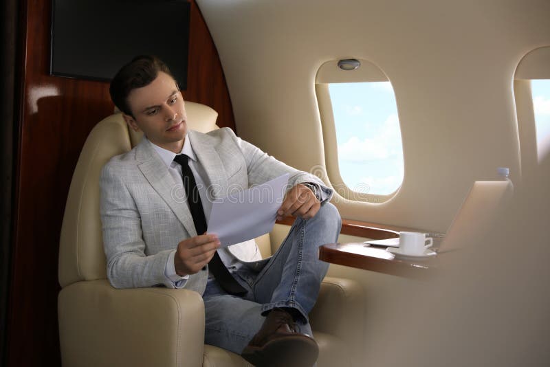 Businessman Working with Documents in Airplane Stock Photo - Image of ...