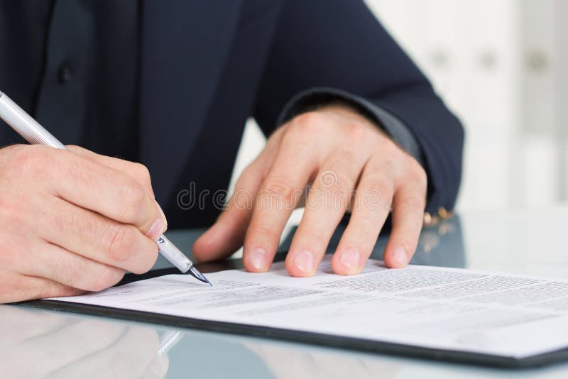 Businessman Signing a Document. Stock Image - Image of manager ...