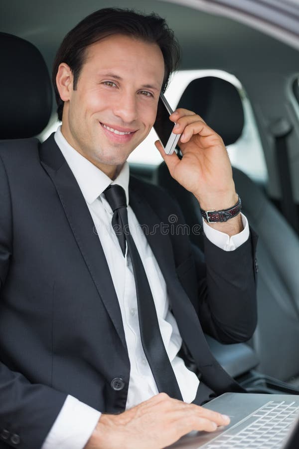Businessman Working in the Drivers Seat Stock Image - Image of laptop ...