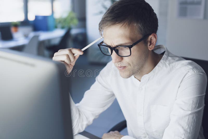 Businessman Working with His Computer and Thinking Stock Image - Image ...