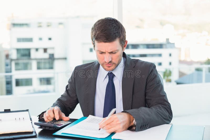 Businessman Working on His Finances at His Desk Stock Image - Image of ...