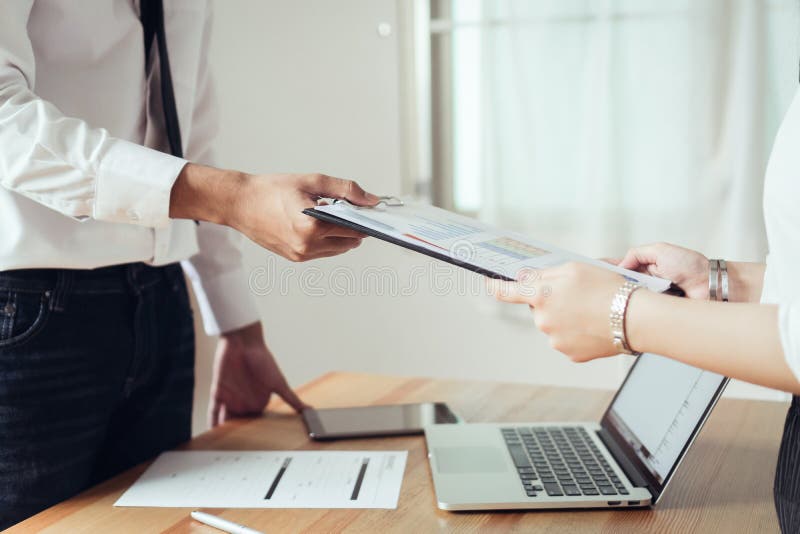 Businessman Working at His Office with Documents and Check the Accuracy ...
