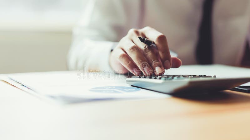 Businessman Working at His Office with Documents and Check the Accuracy ...