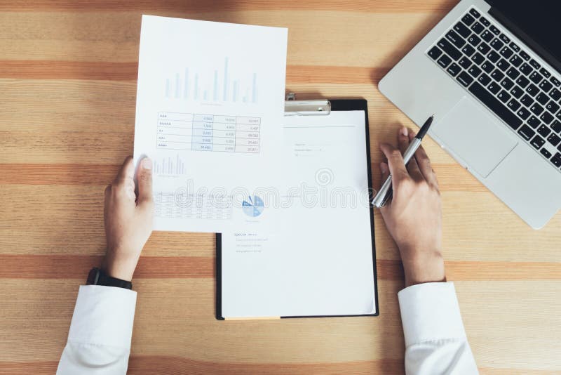 Businessman Working at His Office with Documents and Check the Accuracy ...