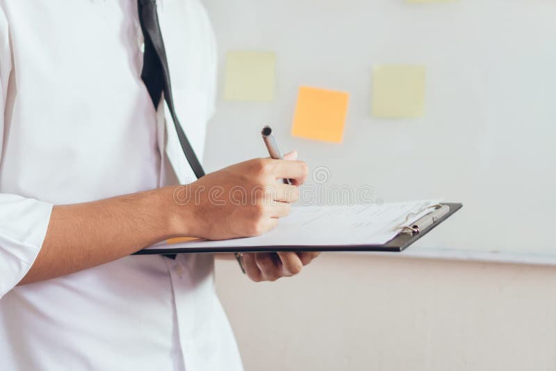 Businessman Working at His Office with Documents and Check the Accuracy ...