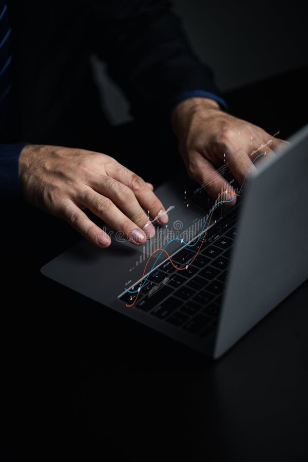 Businessman Working with Holograms Showing Business Graphs and Various ...