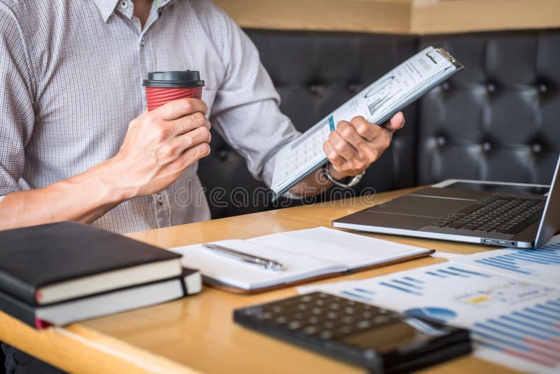 Businessman Working Investment Project on Laptop Computer with Report ...