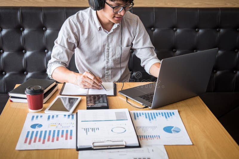 Businessman Working Investment Project on Laptop Computer with Report ...