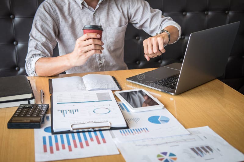 Businessman Working Investment Project on Laptop Computer with Report ...