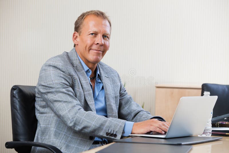 Businessman Working on Laptop Stock Image - Image of office ...