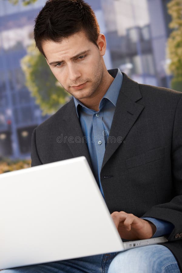Businessman Working on Laptop Stock Image - Image of businessman, color ...