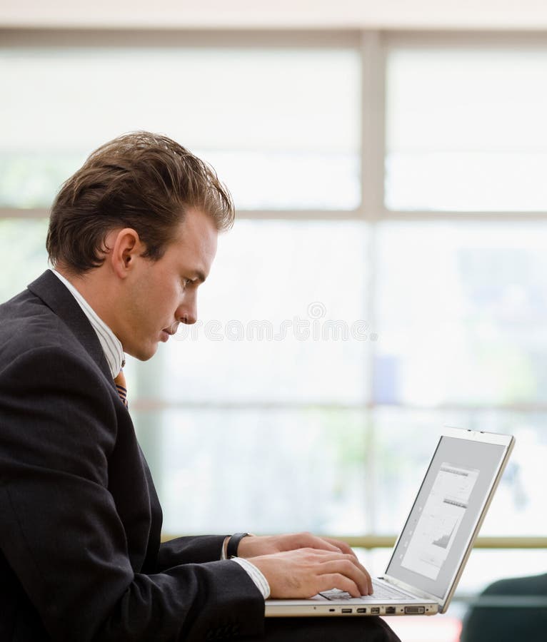 Businessman Working on Laptop Stock Photo - Image of consultant, hall ...