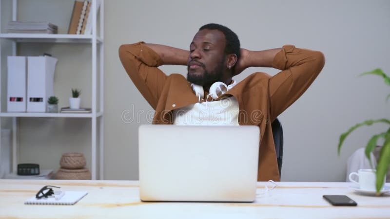 Businessman Working with Laptop Computer and Resting at Table in Modern ...