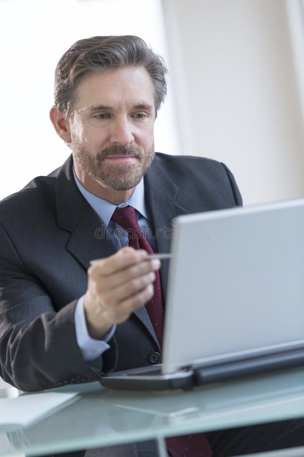 Businessman Working on Laptop at Desk Stock Image - Image of handsome ...