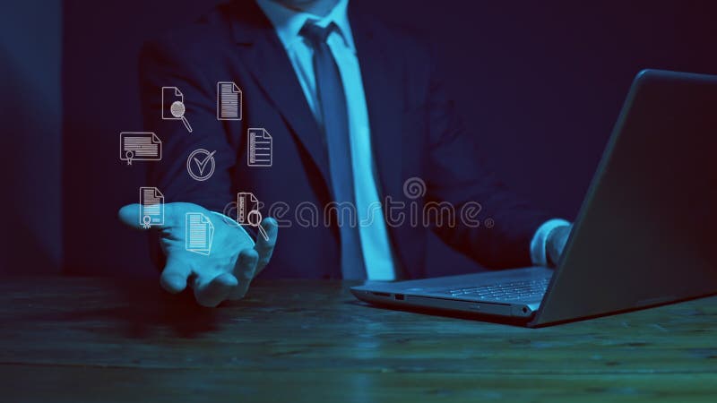 A Businessman Working on a Laptop with One Hand Demonstrates the ...