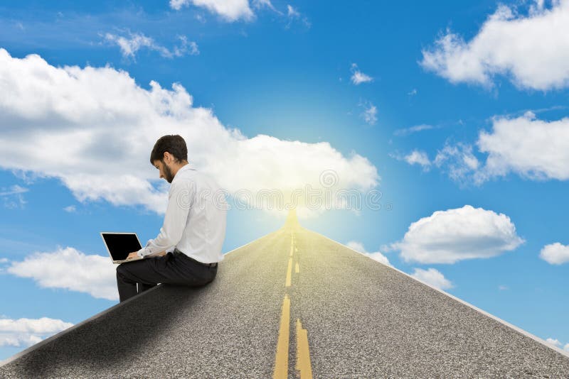 Businessman Working with Laptop on Roadside in the Sky Stock Photo ...