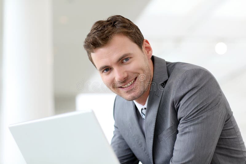 Businessman Working with Laptop Stock Image - Image of banker, hall ...