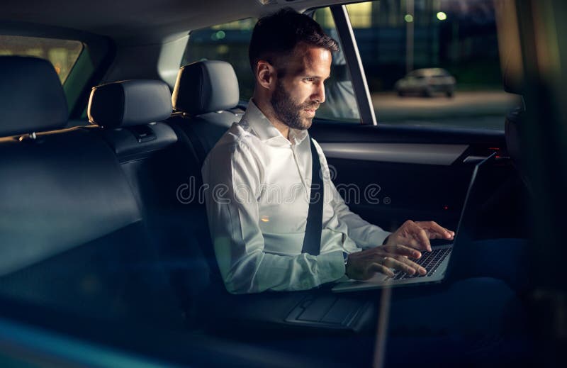 Businessman Working Late in Car on Laptop Stock Image - Image of ...