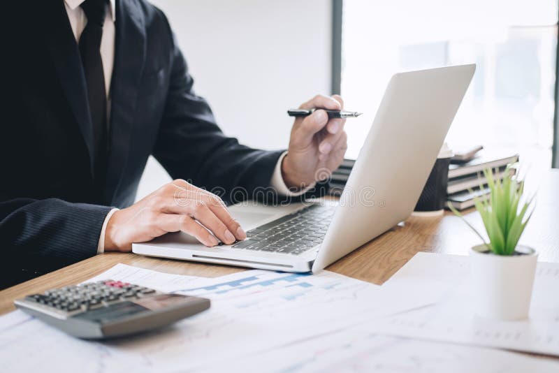 Businessman Working New Project on Laptop Computer with Report Document ...