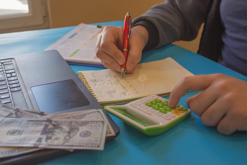 Businessman Working on Office Desk with Calculator, a Computer, a Pen ...