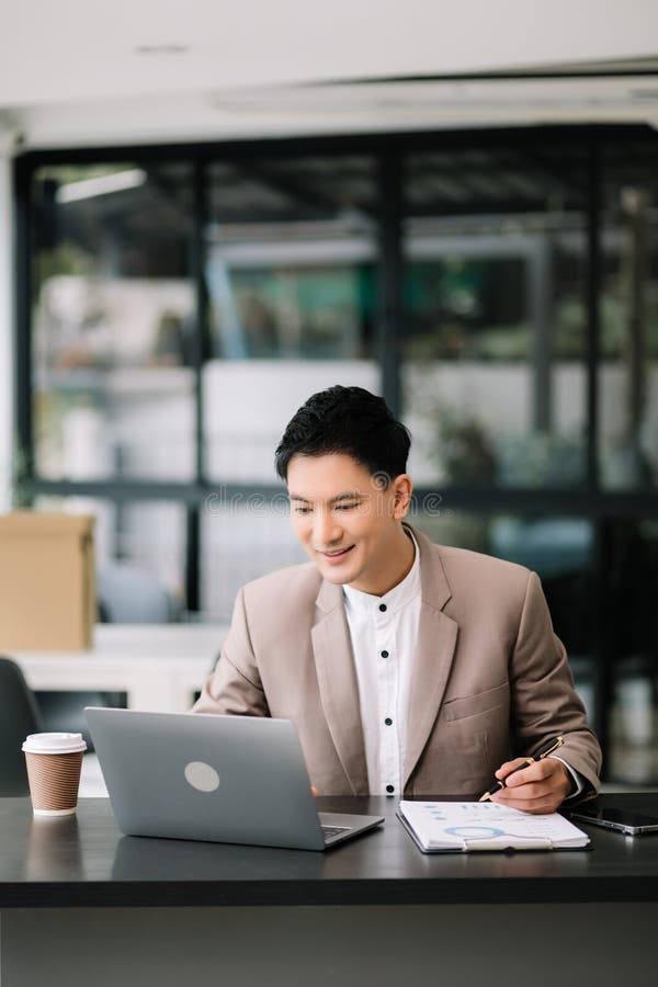 Businessman Working at Office with Laptop, Tablet and Taking Notes on ...