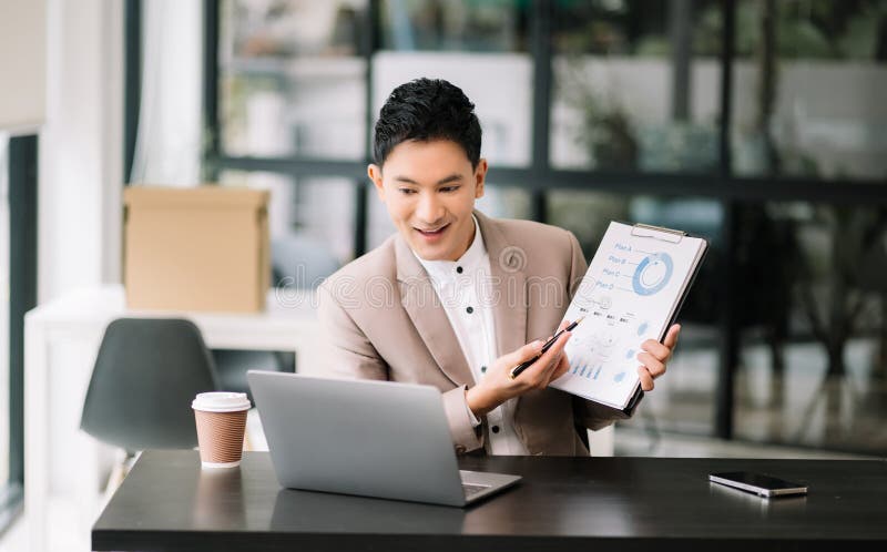 Businessman Working at Office with Laptop, Tablet and Taking Notes on ...