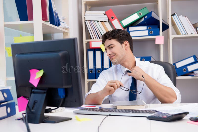 Businessman Working in the Office with Piles of Books and Papers Stock ...