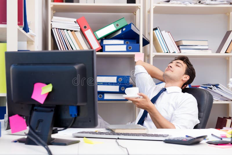 Businessman Working in the Office with Piles of Books and Papers Stock ...