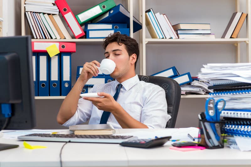 Businessman Working in the Office with Piles of Books and Papers Stock ...