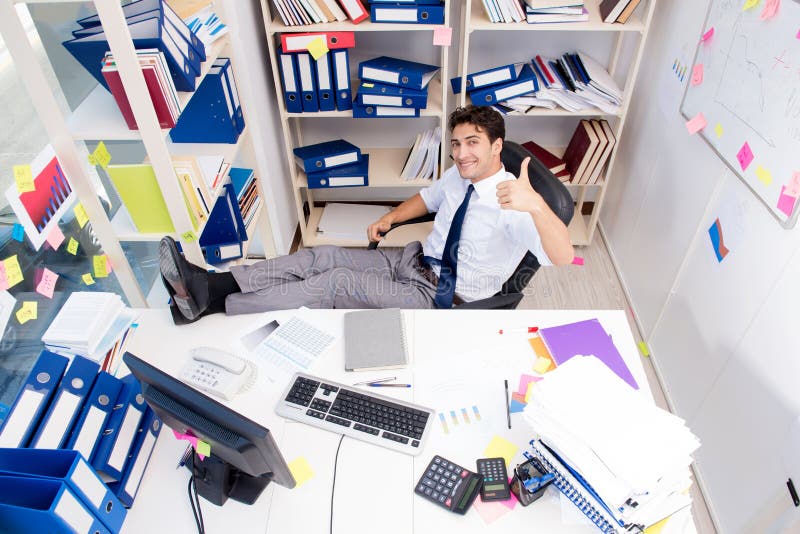 Businessman Working in the Office with Piles of Books and Papers Stock ...