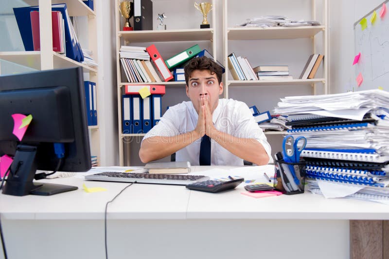 Businessman Working in the Office with Piles of Books and Papers Stock ...