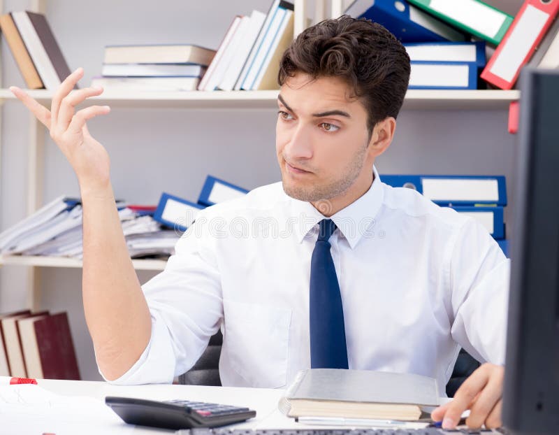 Businessman Working in the Office with Piles of Books and Papers Stock ...