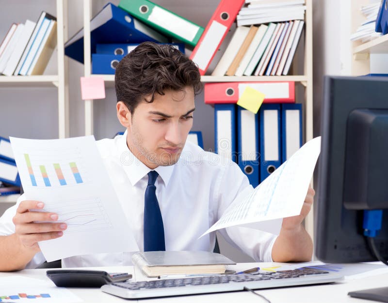 Businessman Working in the Office with Piles of Books and Papers Stock ...