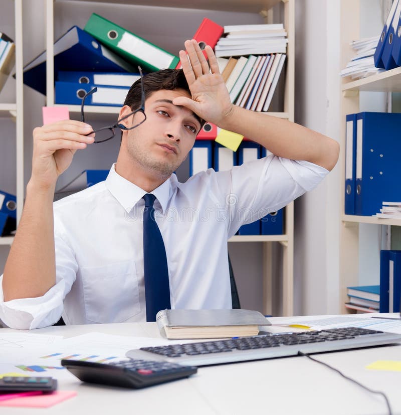 Businessman Working in the Office with Piles of Books and Papers Stock ...