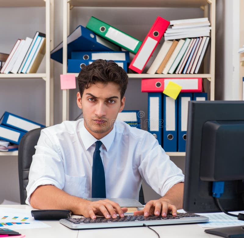 Businessman Working in the Office with Piles of Books and Papers Stock ...