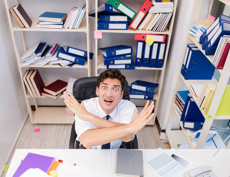 Businessman Working in the Office with Piles of Books and Papers Stock ...