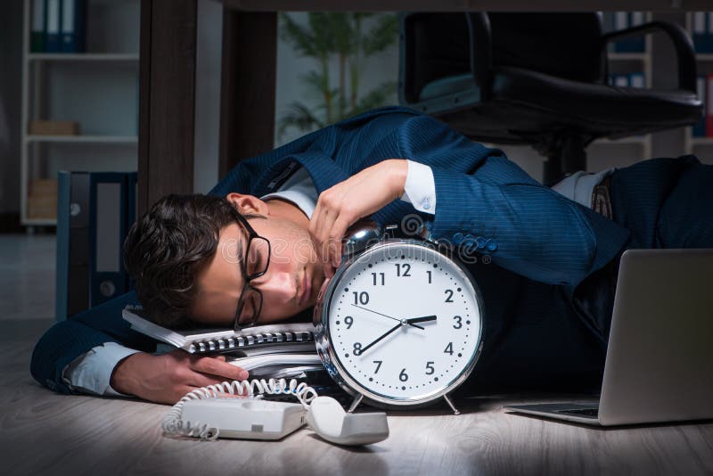 The Businessman Working Overtime Long Hours Late in Office Stock Image ... The Businessman Working Overtime Long Hours Late in Office Stock Image ...