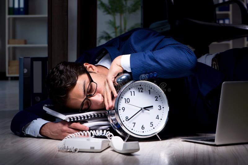 The Businessman Working Overtime Long Hours Late in Office Stock Image ... The Businessman Working Overtime Long Hours Late in Office Stock Image ...