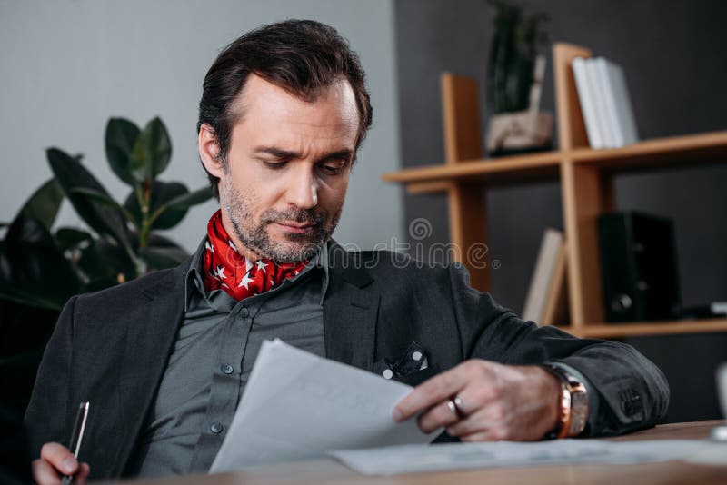 Focused Middle Aged Businessman Working with Papers Stock Photo - Image ...